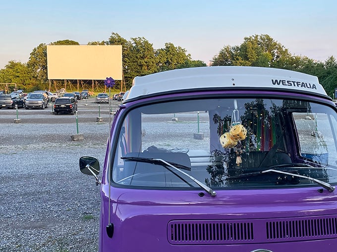 A vintage Volkswagen van faces the blank canvas of possibility. Some folks don't just watch movies at the drive-in—they experience them in style.