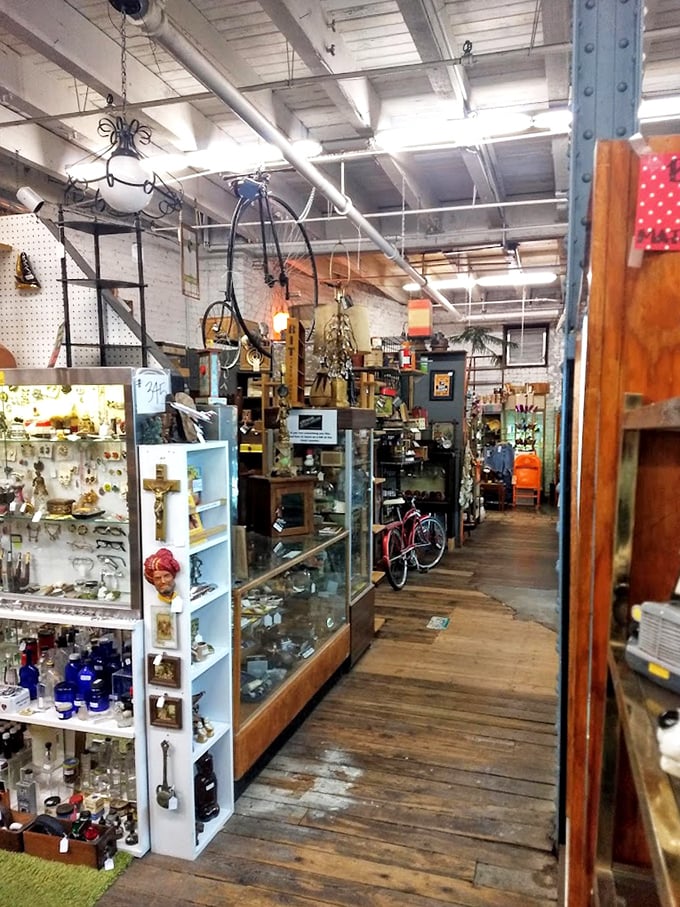 Industrial chic meets vintage charm with antique bicycles hanging from the ceiling—proof that yesterday's transportation makes today's perfect conversation piece.