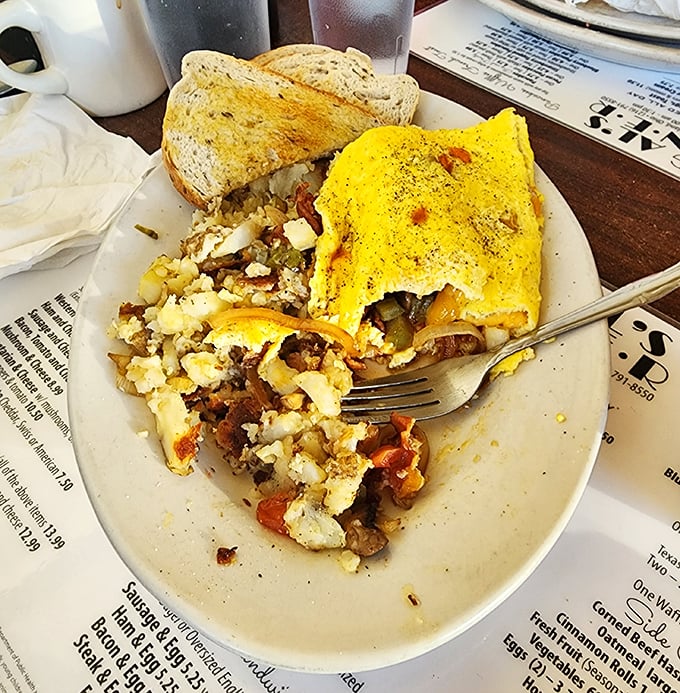 When an omelet meets corned beef hash, it's not just breakfast—it's a Cleveland love story folded into yellow perfection.