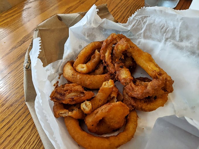 Golden, crispy onion rings that shatter with each bite. The perfect sidekick to a cheesesteak—like Abbott to Costello, but deliciously fried.