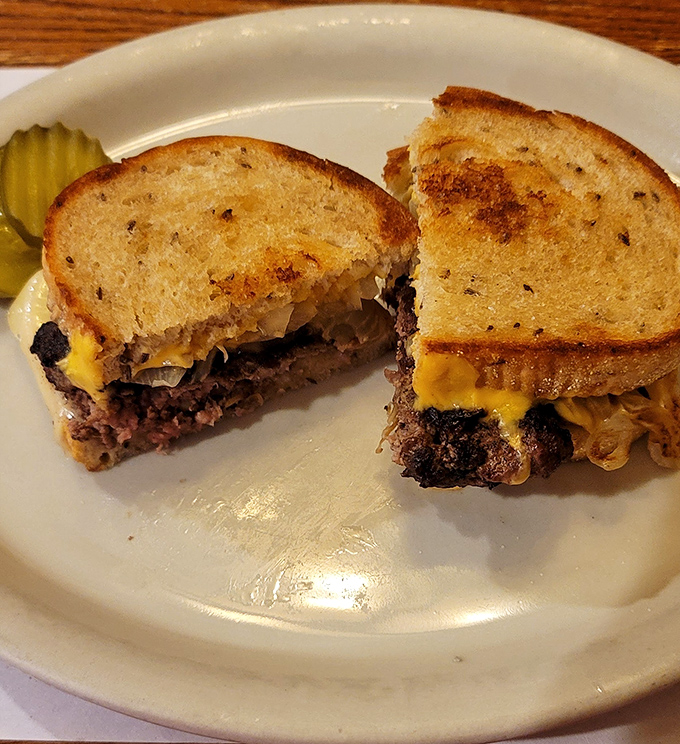 The patty melt—where caramelized onions, melted cheese, and perfectly grilled rye bread come together in a sandwich that would make your cardiologist wince and your taste buds sing.