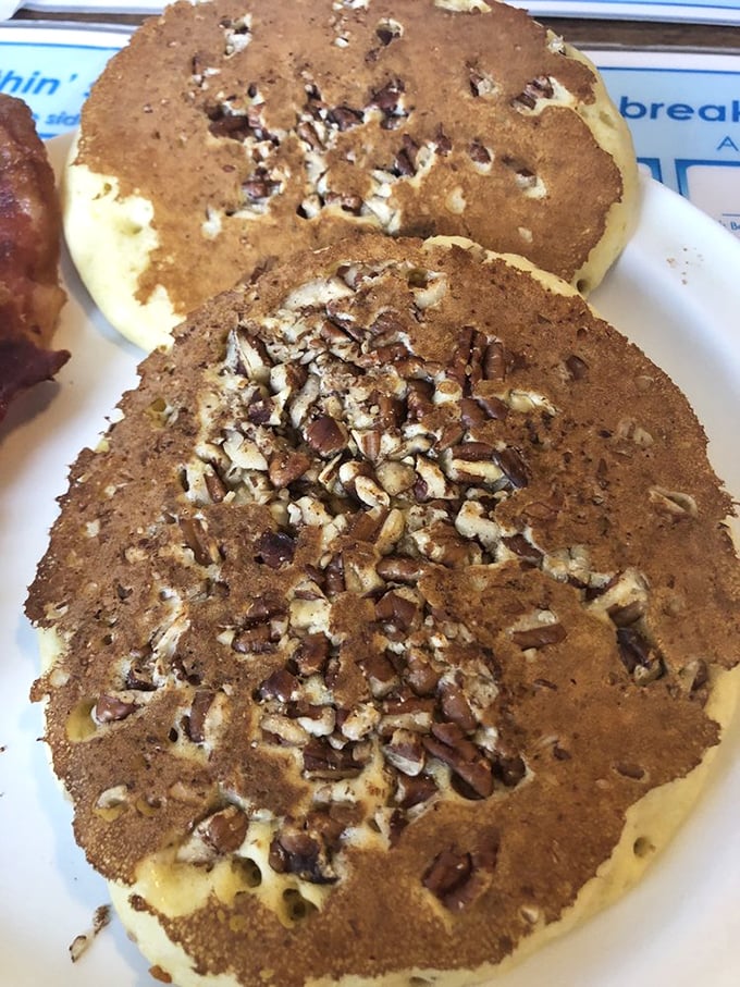 These pecan pancakes aren't just breakfast, they're an architectural achievement. The nuts create little flavor pockets that make every bite a different delicious experience.