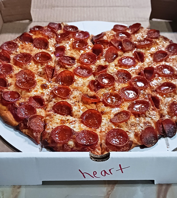 Pepperoni that curls into little flavor cups, creating tiny pools of deliciousness. This isn't just pizza—it's edible architecture.