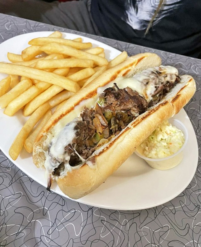 This Philly cheesesteak isn't just a sandwich – it's a commitment to excellence that requires both hands and several napkins.