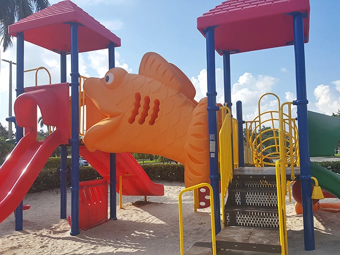 This whimsical fish playground proves someone at the outlet mall understood that shopping with children requires strategic bribery in the form of slides and climbing structures.