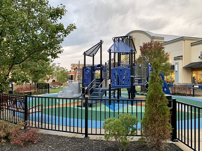 The playground oasis where smart parents let little ones burn energy between stores. "Five more minutes of sliding means Mommy gets five more minutes at Nike."