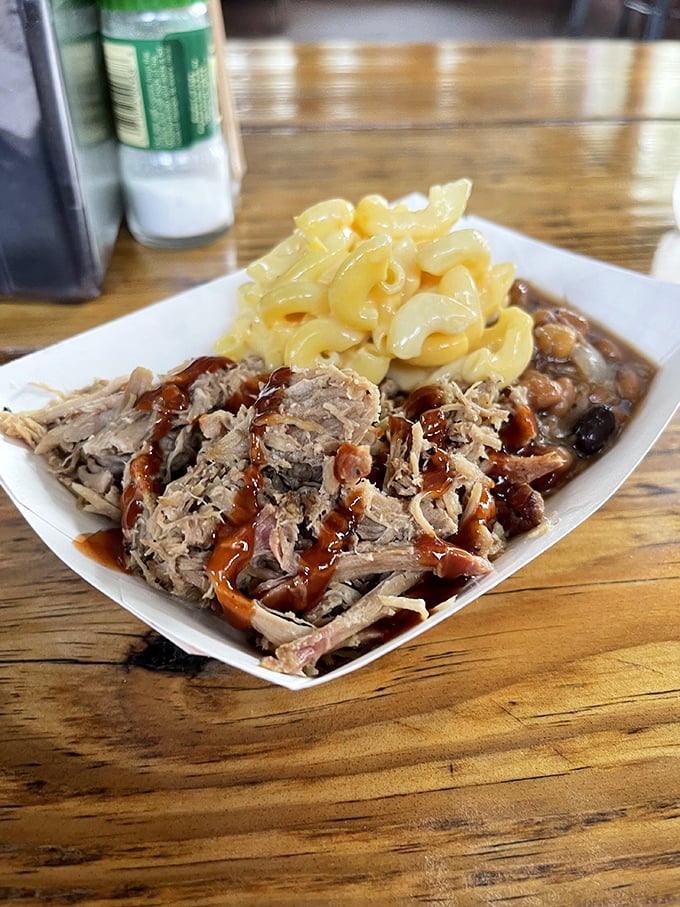 Pulled pork and mac & cheese: the dynamic duo of comfort food. One forkful and suddenly all your life problems seem manageable—at least until the plate's empty.