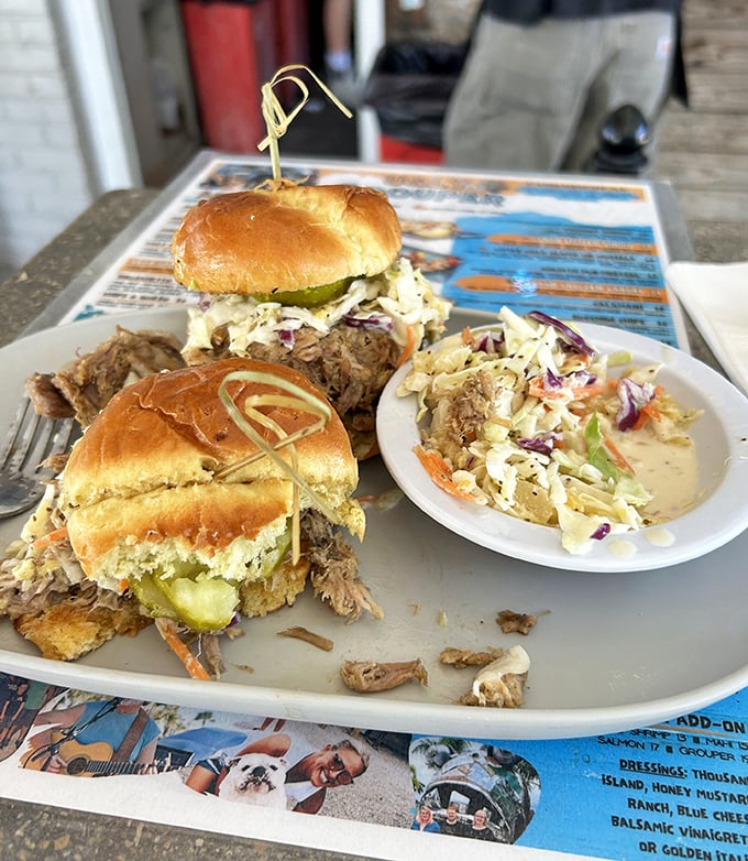 These pulled pork sliders aren't just sandwiches—they're tiny ambassadors of joy, complete with the coleslaw diplomacy that brings peace to your palate.