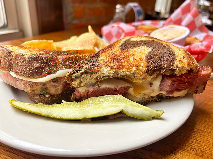 Not just a sandwich, but a work of art—layers of corned beef and melted cheese creating the Sistine Chapel of lunch options.