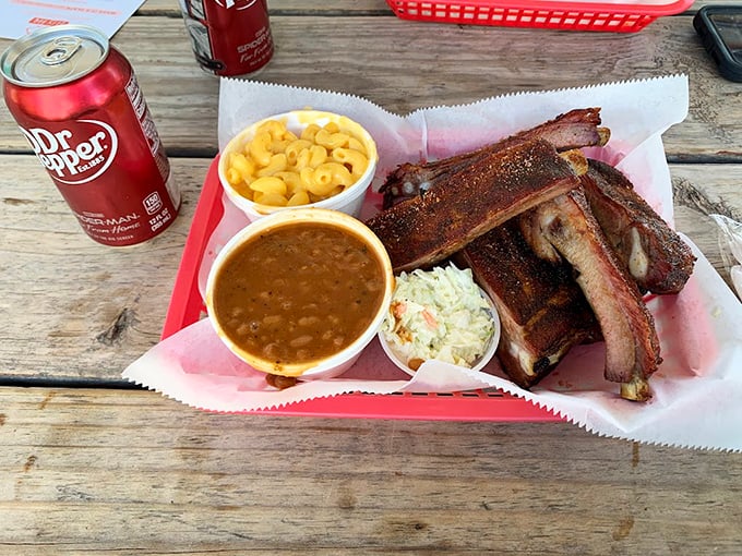 Ribs, mac and cheese, and baked beans – the holy trinity of barbecue companionship, best enjoyed with a Dr. Pepper and zero regrets.