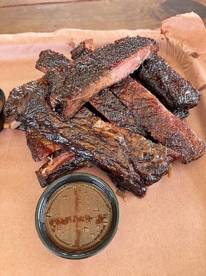 Ribs with a mahogany exterior that gives way to juicy perfection. The kind of barbecue that makes you forget table manners exist.