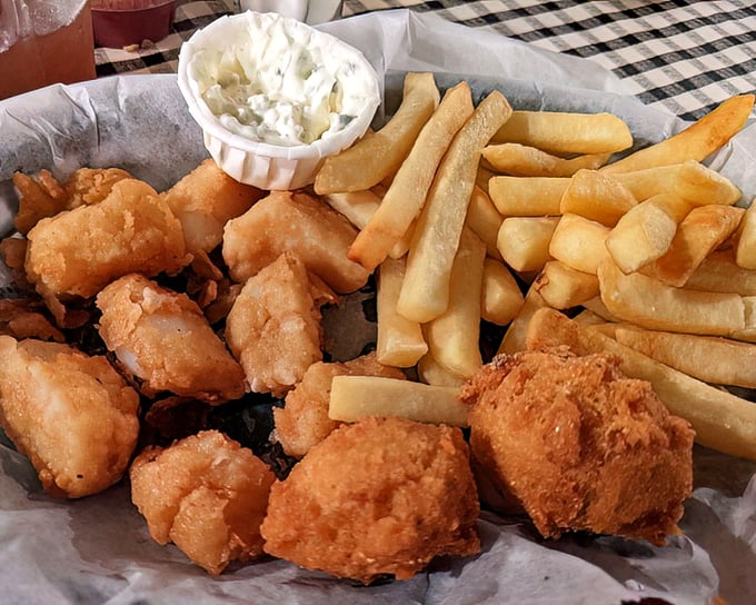 Seafood and sides that don't need fancy plating – just honest-to-goodness fried goodness, crispy fries, and a dollop of coleslaw that completes the holy trinity.