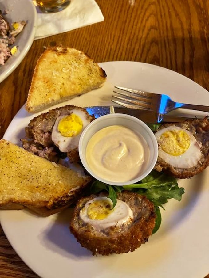 Scotch eggs – where breakfast meets engineering. Perfectly cooked eggs wrapped in savory sausage armor, then fried to golden perfection. Renaissance painters missed their chance.