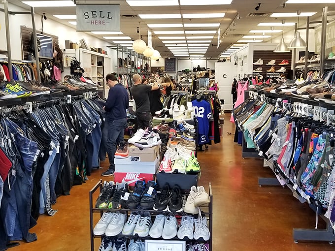 Treasure hunters browse while shoppers in the background score their own fashion finds. The thrill of the hunt is palpable.