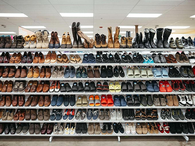 The shoe wall stands like a monument to every journey taken—work boots to wedding heels, all seeking new adventures.