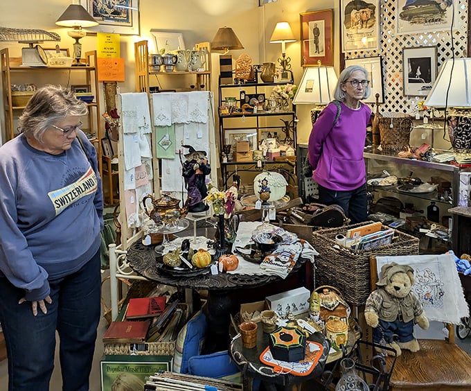 The true antique experience: fellow hunters examining treasures with the careful scrutiny of archaeologists on the verge of discovery.