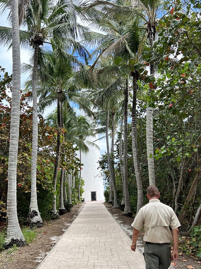 A palm-lined path leading to paradise—or at least to a historic lighthouse, which is Florida's version of a time machine.