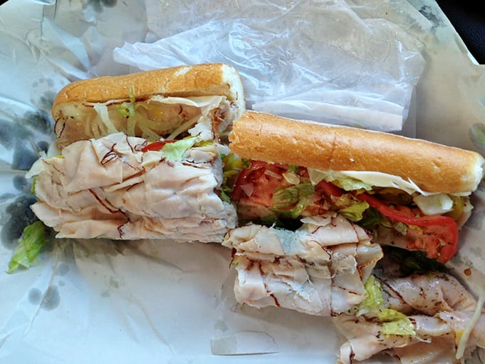 The turkey sub in all its glory—layers of thinly sliced turkey, fresh veggies, and that perfect bread. This isn't lunch; it's an edible masterpiece.