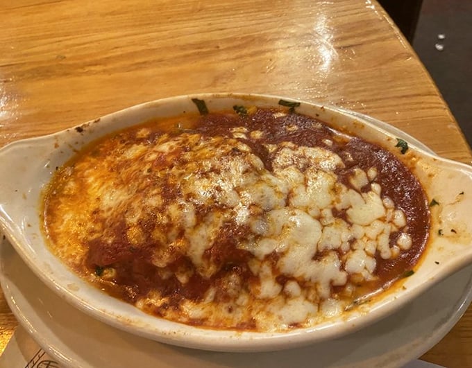 Lasagna that doesn't just sit on the plate—it beckons, bubbling with cheese and promising comfort in every forkful.