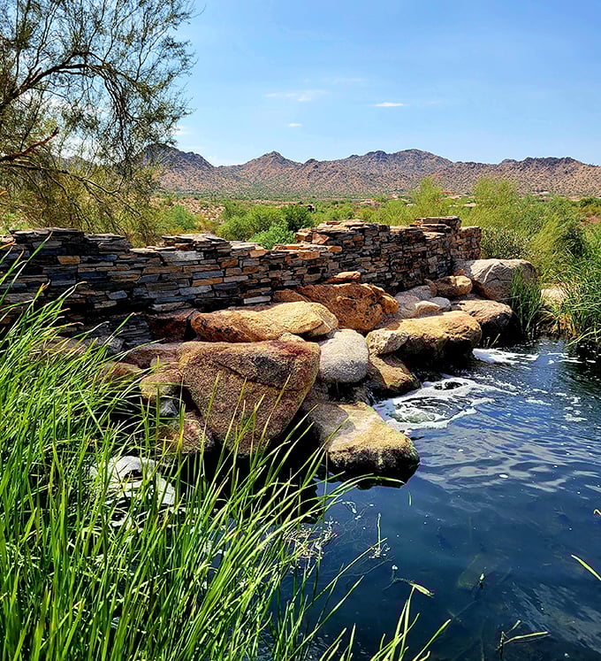 A desert oasis that feels like finding an unexpected $20 in your jeans – cool water, ancient stones, and the mountains creating nature's perfect backdrop.