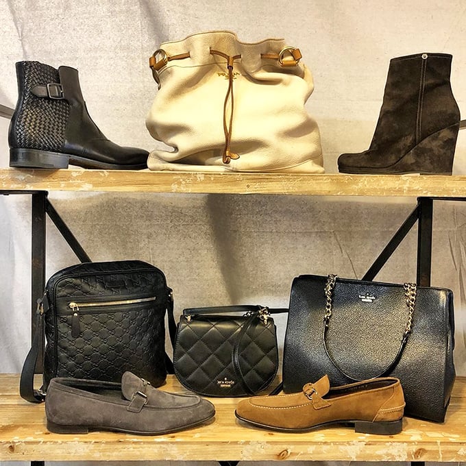 A leather lover's dream tableau – designer boots and handbags arranged with the reverence usually reserved for exhibits at the Art Institute.