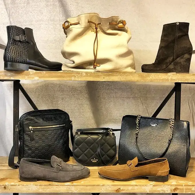 A leather lover's dream tableau – designer boots and handbags arranged with the reverence usually reserved for exhibits at the Art Institute.