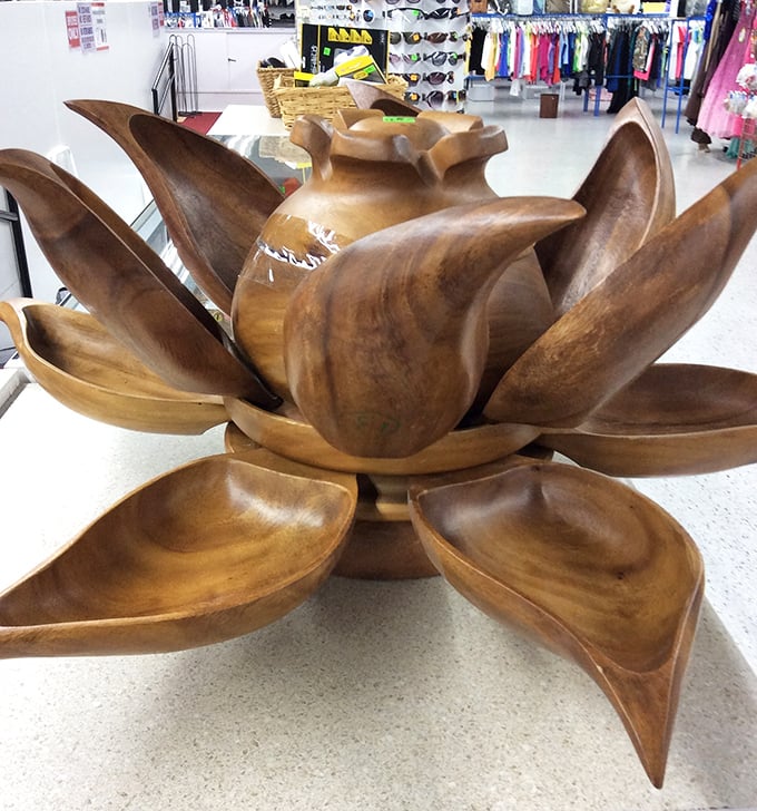 Nature-inspired artistry carved from solid wood. This lotus-shaped serving piece would make even takeout feel like a special occasion.