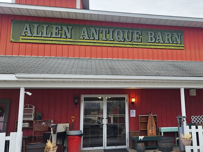 The red barn exterior promises authentic country antiques and down-home treasure hunting experiences.