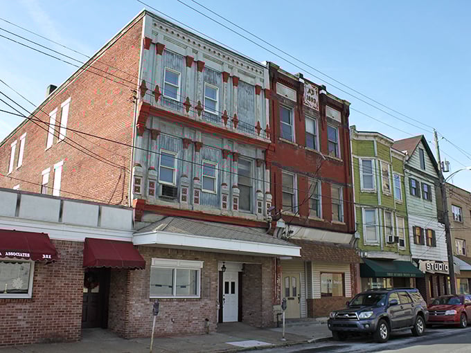 Charleroi's main street offers a glimpse into the town's industrial past with well-preserved buildings now housing affordable businesses.