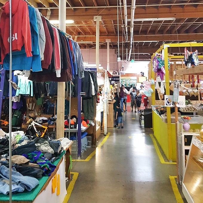 Rows of colorful clothing create a vibrant shopping maze at La Pulga Fantástica. Like walking through your eccentric aunt's closet—if she owned everything!