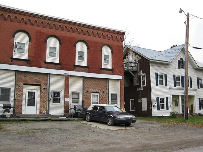Simple brick and wood buildings in Milford echo the town’s quiet history, where everyday life still unfolds against a backdrop of the past.