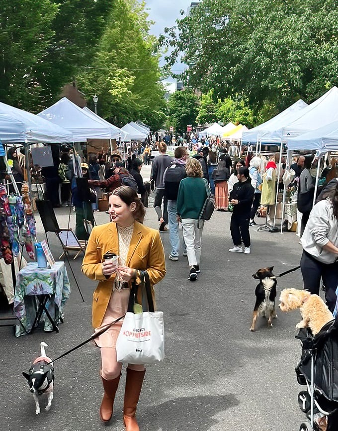 Portland Flea's outdoor tents create a festival atmosphere where shoppers and their furry friends hunt for treasures together.