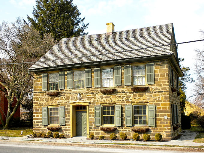 Stone house with green shutters showcases Pennsylvania German craftsmanship - they definitely don't build them like this anymore.