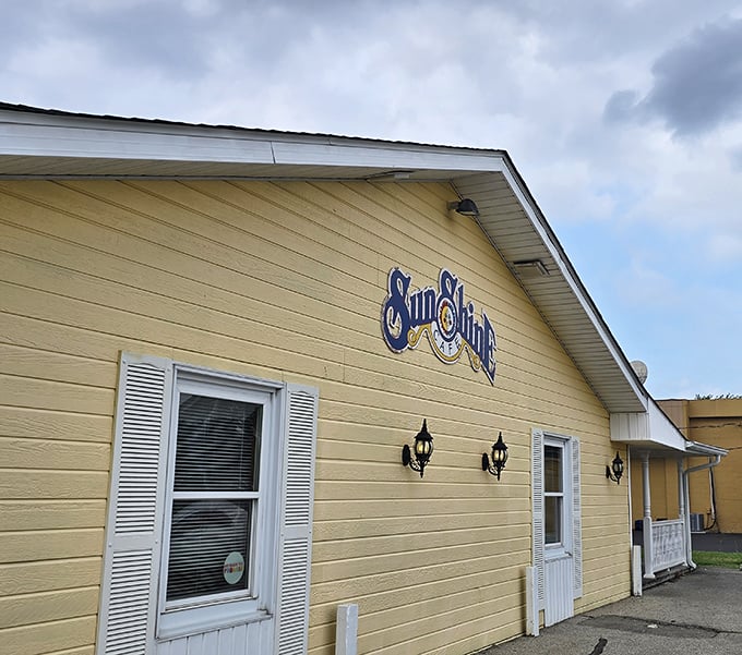 Yellow sunshine exterior matches the warm breakfast vibes - Sunshine Cafe doesn't hide what it's all about.