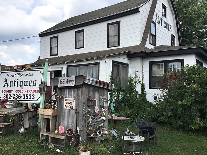 "BE Happy" isn't just a sign—it's what happens naturally when you discover this white farmhouse filled with rustic treasures and timeworn charm.