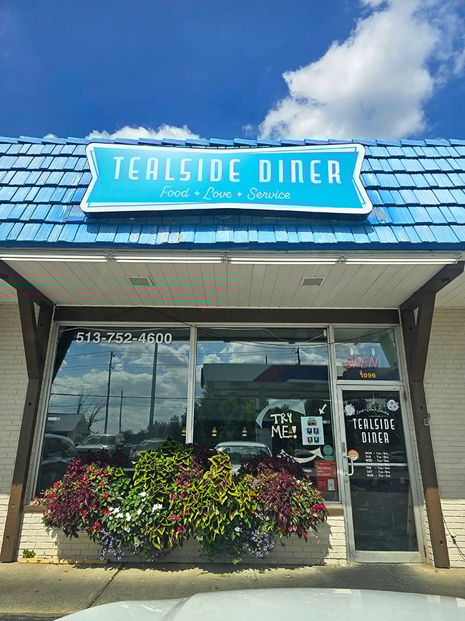 That bright blue roof is like a beacon for hungry travelers – "Pull over here for breakfast bliss!"