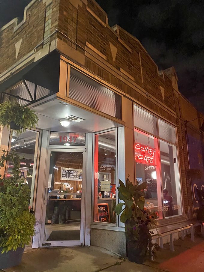 The Comet Cafe glows with late-night breakfast potential. That neon sign isn't just illuminating the street—it's lighting the way to satisfaction.