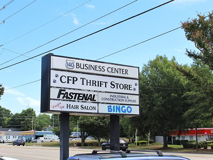 The roadside sign for Cause for Paws shows it's part of a bustling business center. Those paw prints on the sign are a gentle reminder that shopping here helps animals in need!