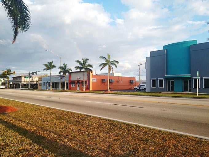 Rainbow over Clewiston's colorful storefronts—Mother Nature's way of saying, "You think YOUR paint job is impressive? Hold my sunbeam."