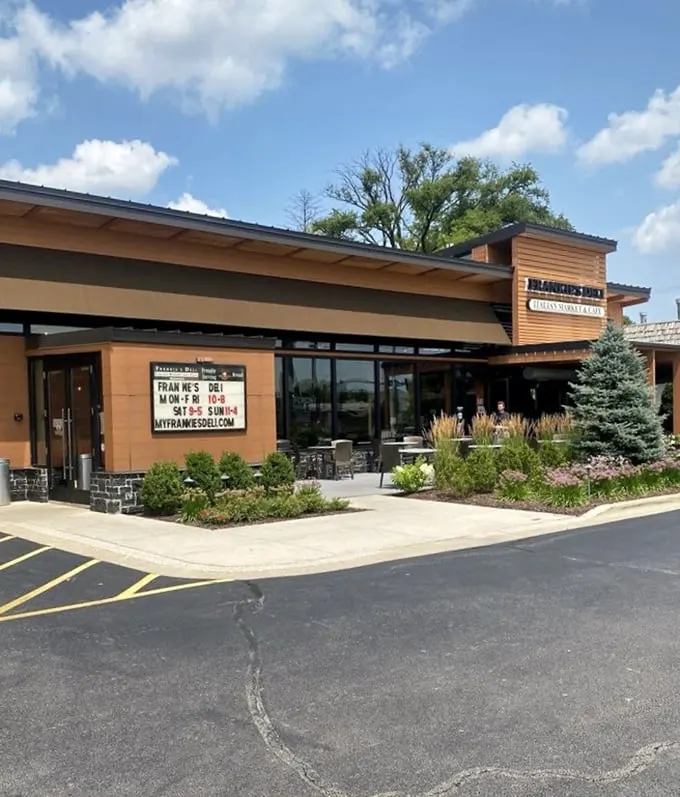 Clean lines and warm wood tones create the perfect backdrop for serious deli craftsmanship.