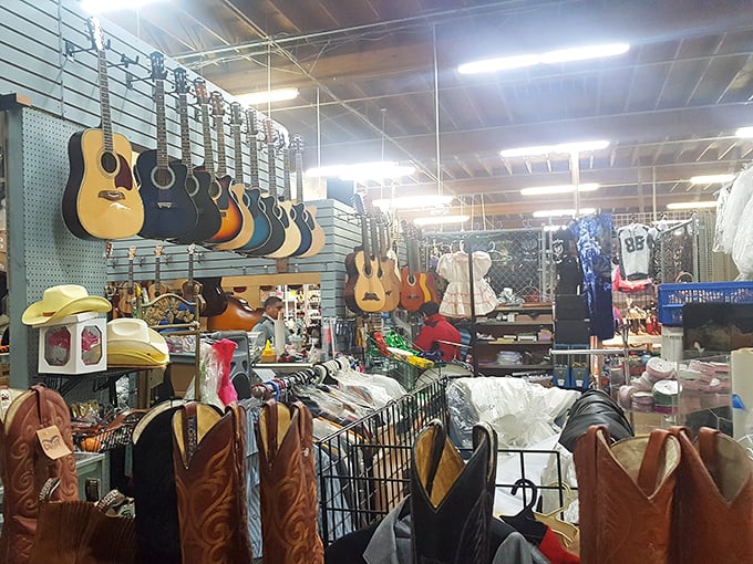 Guitars hang like ripe fruit waiting to be picked at La Pulga Fantástica. Someone's next musical journey starts with these strings!