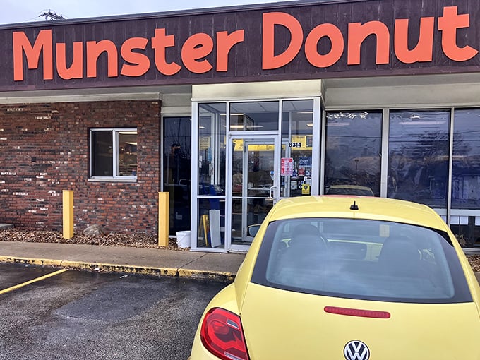 That little yellow Bug knows what's up – parked front and center at Munster Donut like it's claiming first dibs on fresh batches.