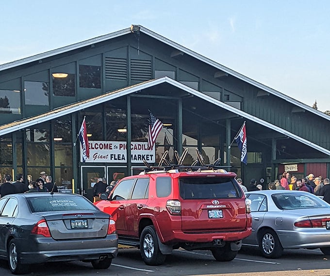 Cars line up like eager contestants waiting to enter Picc-A-Dilly's treasure hunt. That red SUV knows what's up—the early bird gets the vintage vinyl!