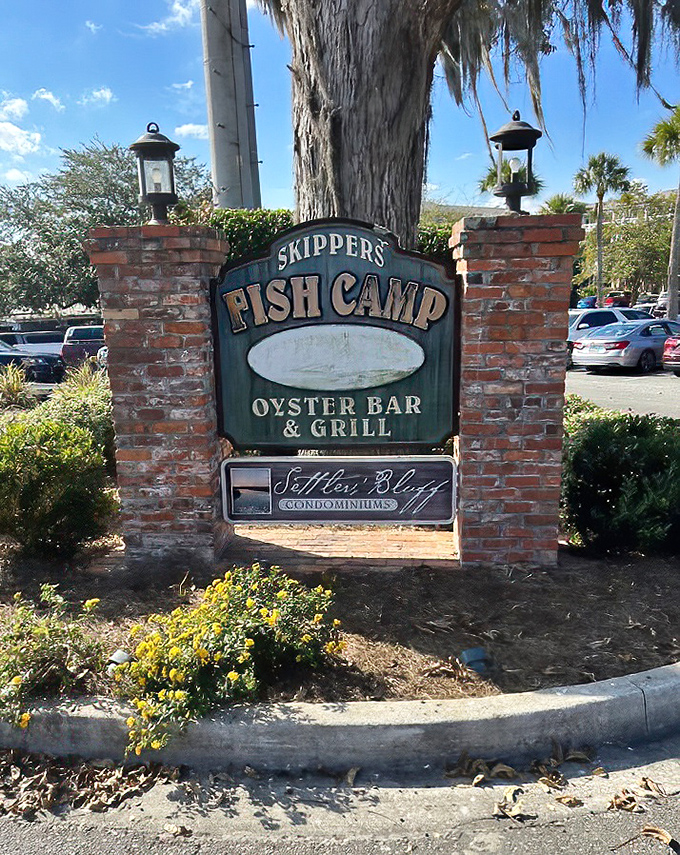 That classic green sign promises what Skipper's delivers – an authentic fish camp experience without the sleeping bags or mosquitoes.
