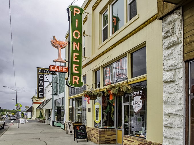 That neon Pioneer sign with its cheeky cocktail glass promises libations the way grandpa enjoyed them—strong and straightforward!