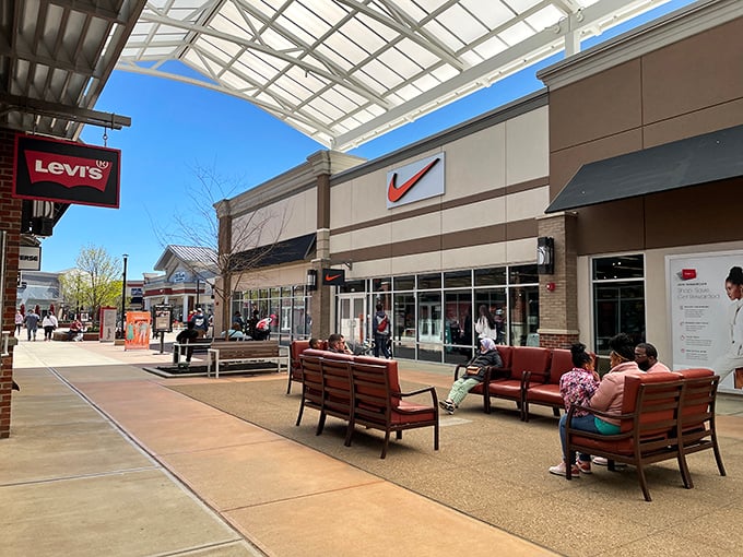 Modern shopping comfort with trees providing shade - someone actually thought about tired shoppers here.