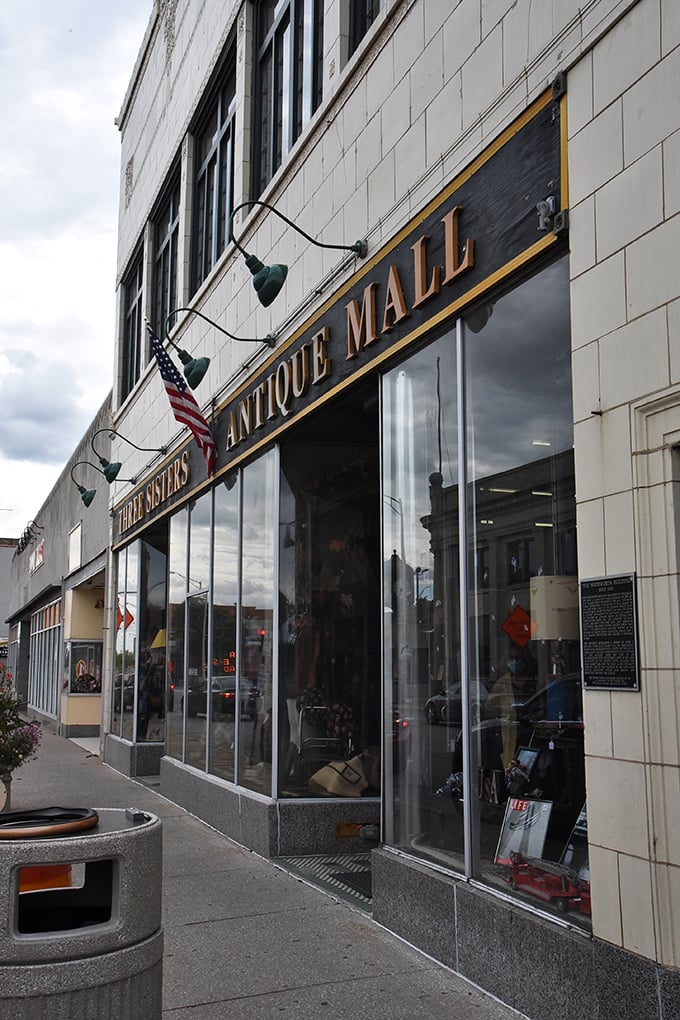 Those green lamps illuminate more than just a sign—they light the way to multiple floors of vintage wonderland.