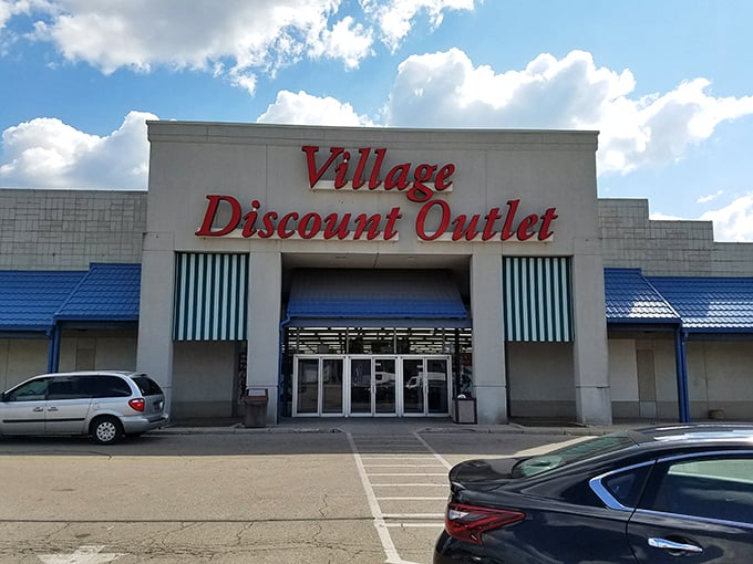 Those blue awnings have shaded the dreams of budget-conscious shoppers for years. What treasures await behind those glass doors today?