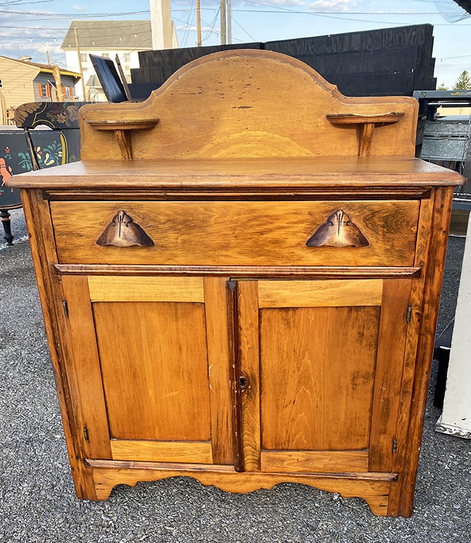 This antique dry sink cabinet has witnessed more family dinners than your favorite sitcom – its patina telling stories of generations past.