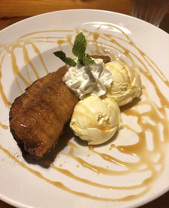 Dessert that would make Grandma both proud and jealous. Golden fried pastry meets vanilla ice cream in a caramel-drizzled romance for the ages.